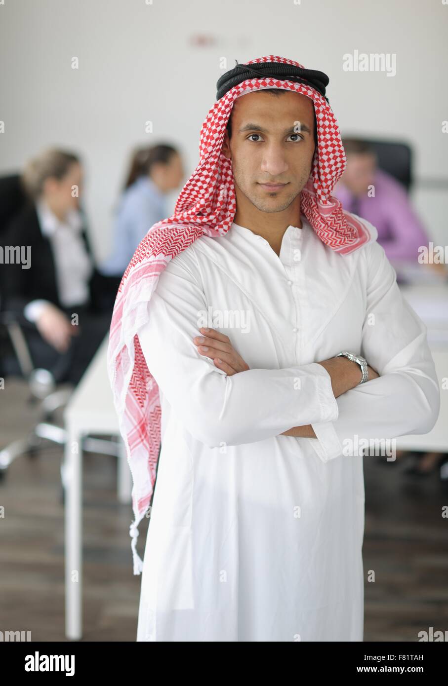 Business meeting - Handsome young Arabic man presenting his ideas to ...