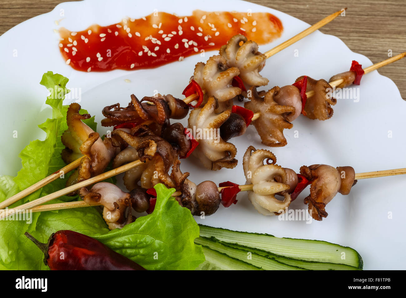 Barbecue baby octopus with bell pepper and spices Stock Photo - Alamy
