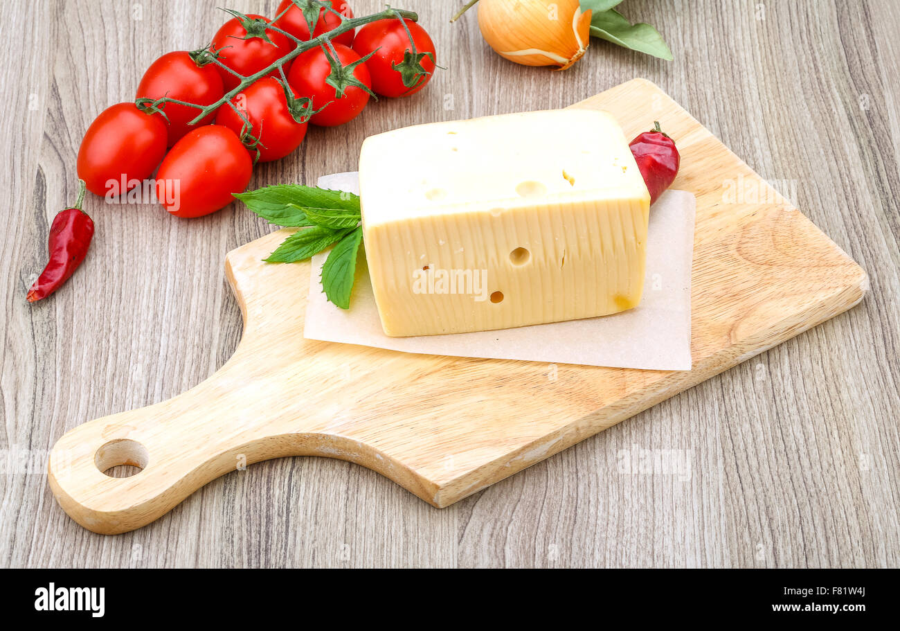 Yellow cheese brick with mint leaves on the wood background Stock Photo ...