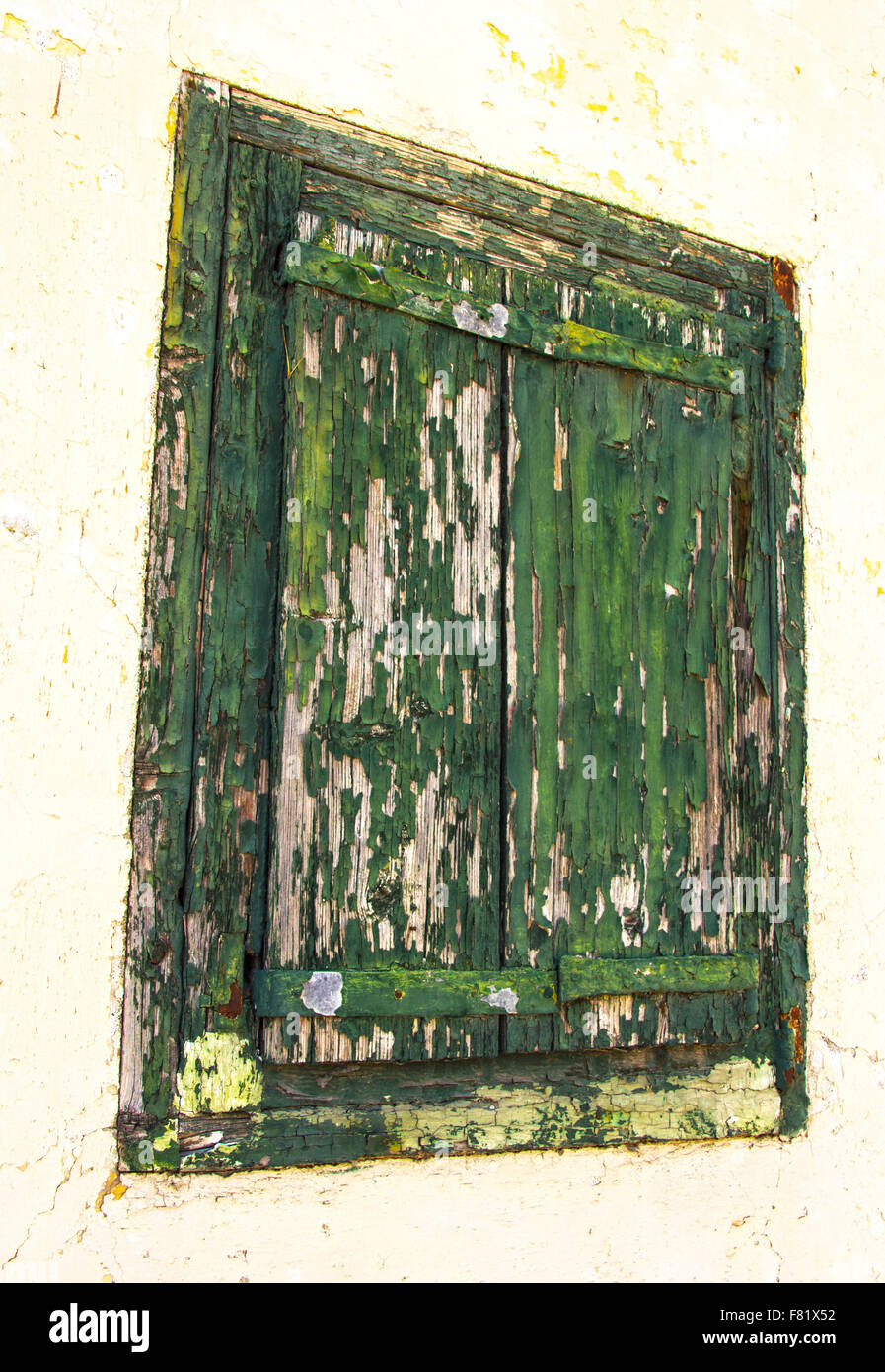 Valletta old worn out wood window shutters Stock Photo - Alamy