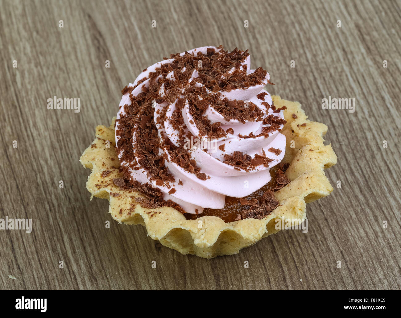 Sweet fresh Cream cup cake on the wood background Stock Photo - Alamy