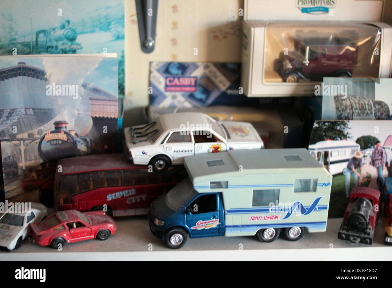 Vintage toy model cars and van with a train Stock Photo - Alamy