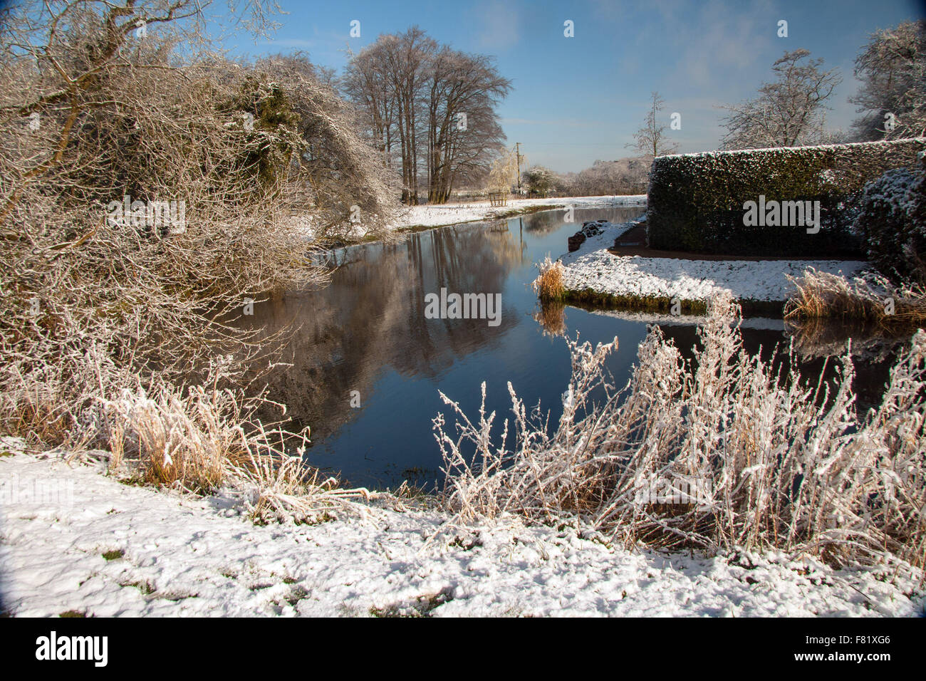 Cheshire winter landscape in the snow showing the moat around Little ...
