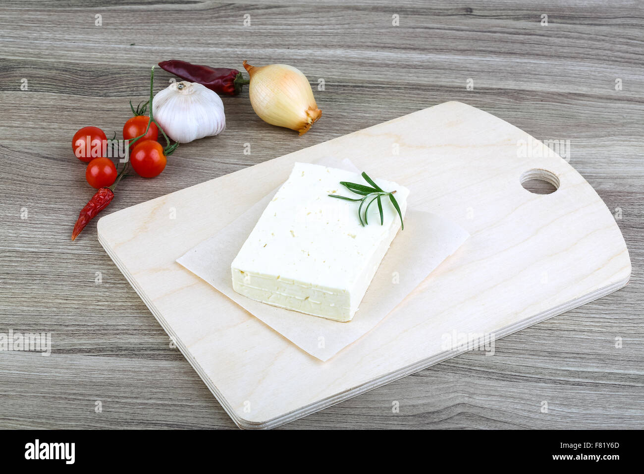 Traditional Caucasian homemade Cheese Brinza with rosemary on wood ...