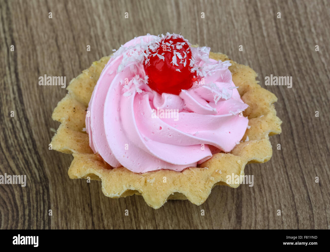 Sweet fresh Cream cup cake on the wood background Stock Photo - Alamy