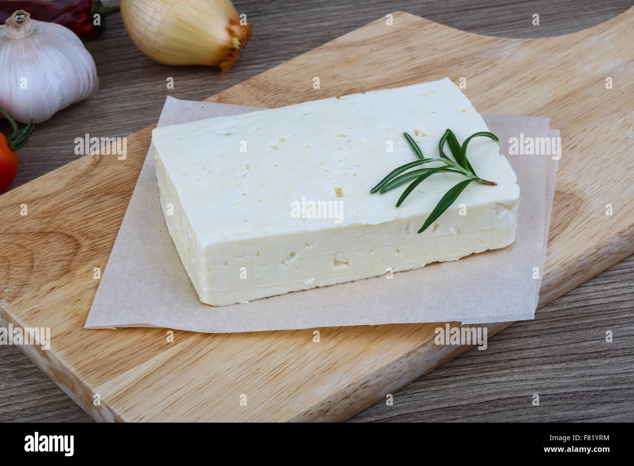 Traditional Caucasian homemade Cheese Brinza with rosemary on wood ...