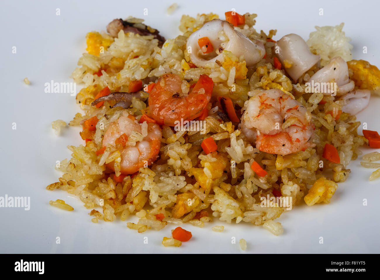 Asian traditional Fried rice with seafood on the wood background Stock ...