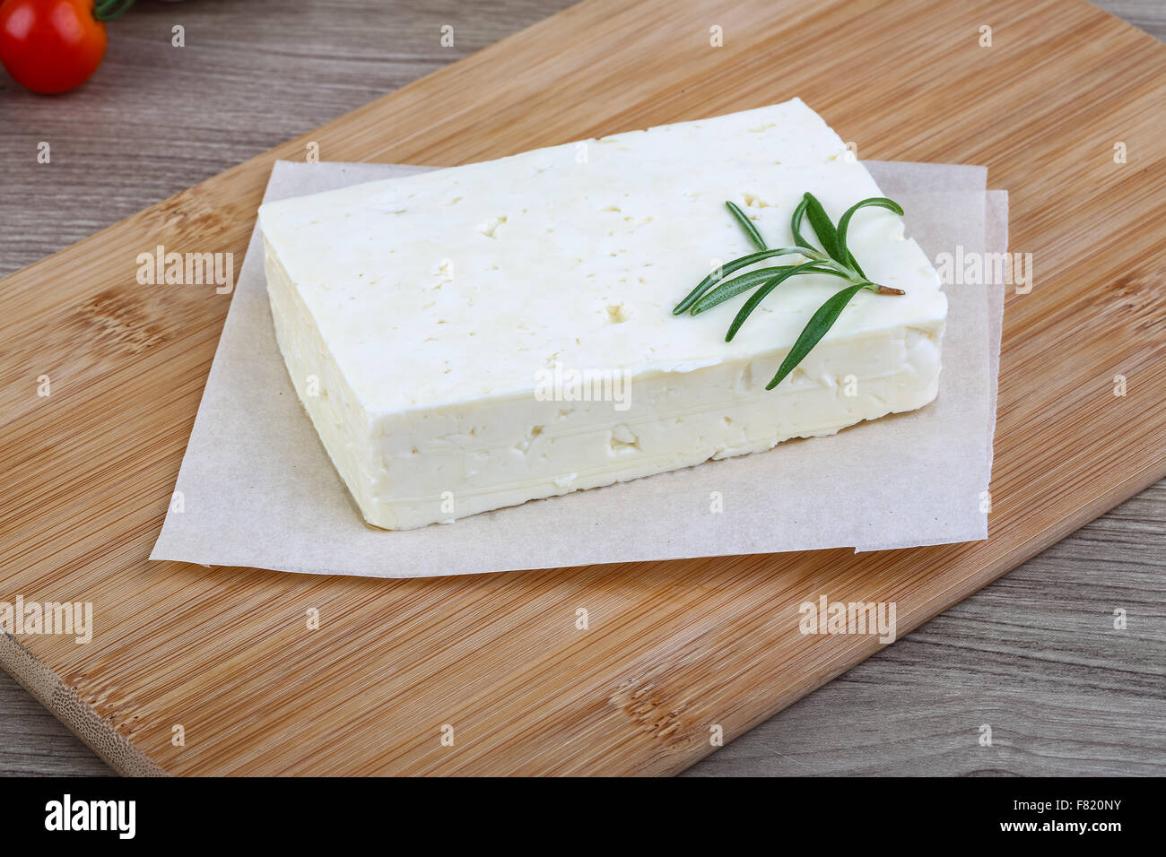 Traditional Caucasian homemade Cheese Brinza with rosemary on wood ...