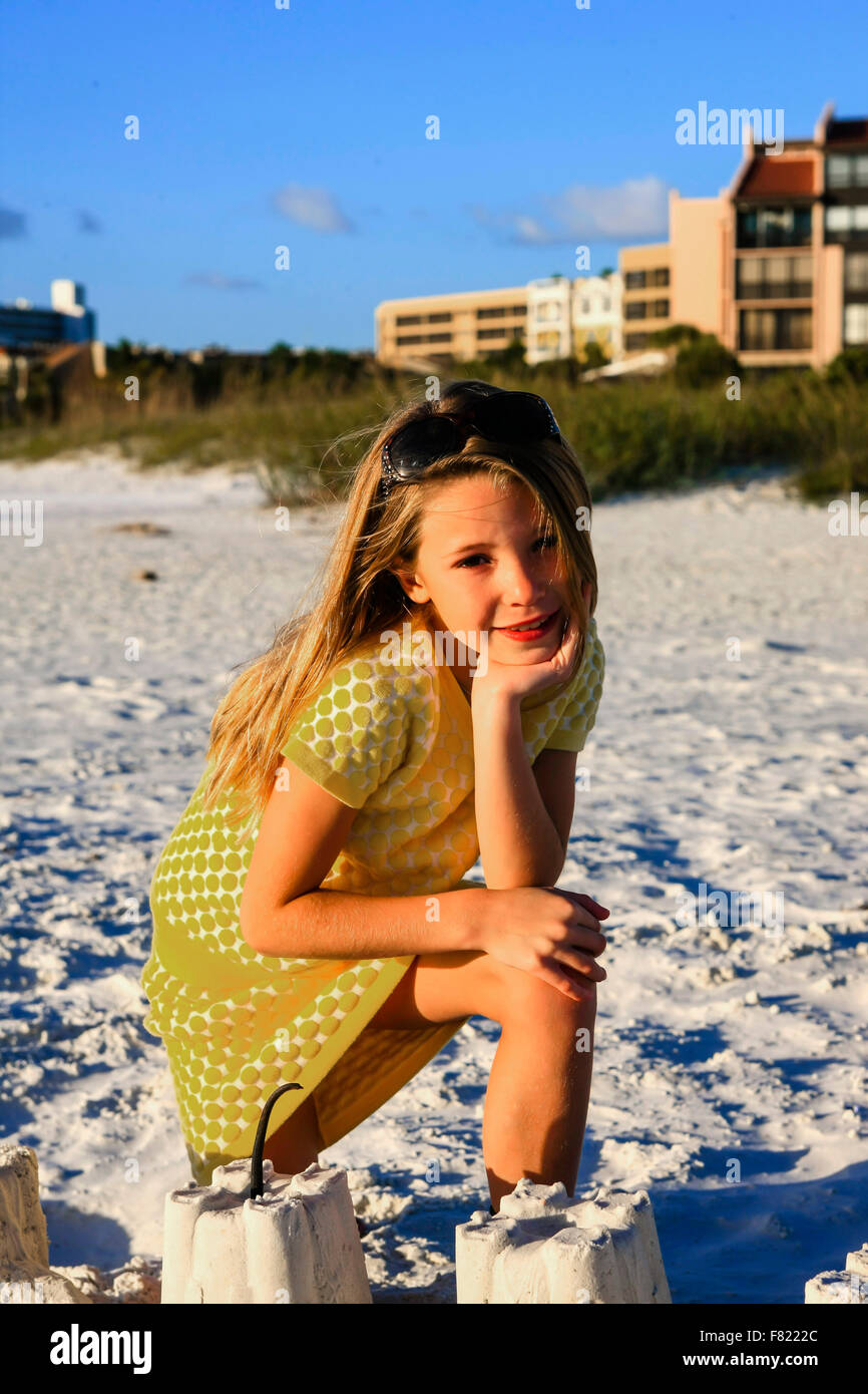 Young Girl Posing At Sunset By The Sand Castle She Built On Siesta Key