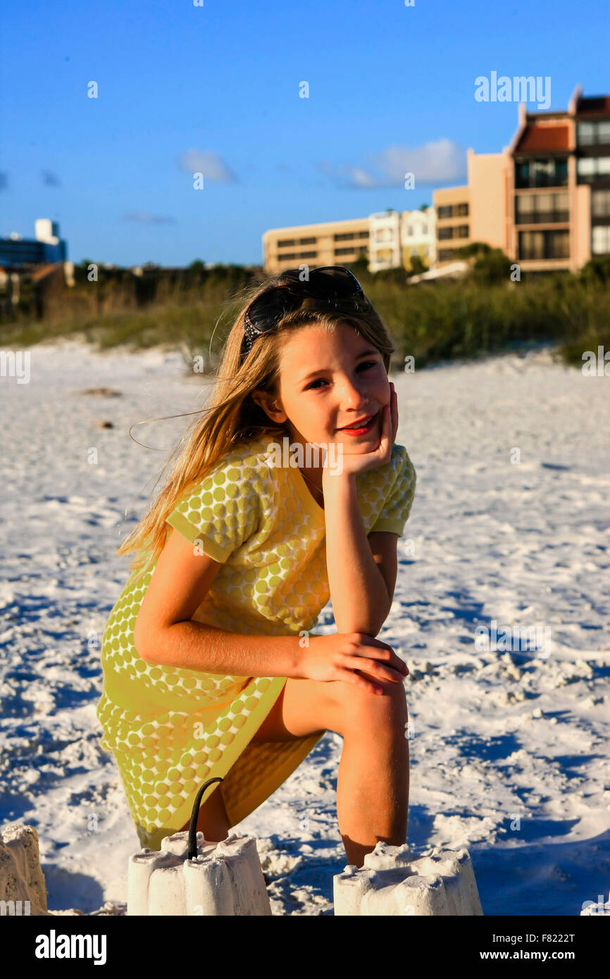 Young Girl Posing At Sunset By The Sand Castle She Built On Siesta Key