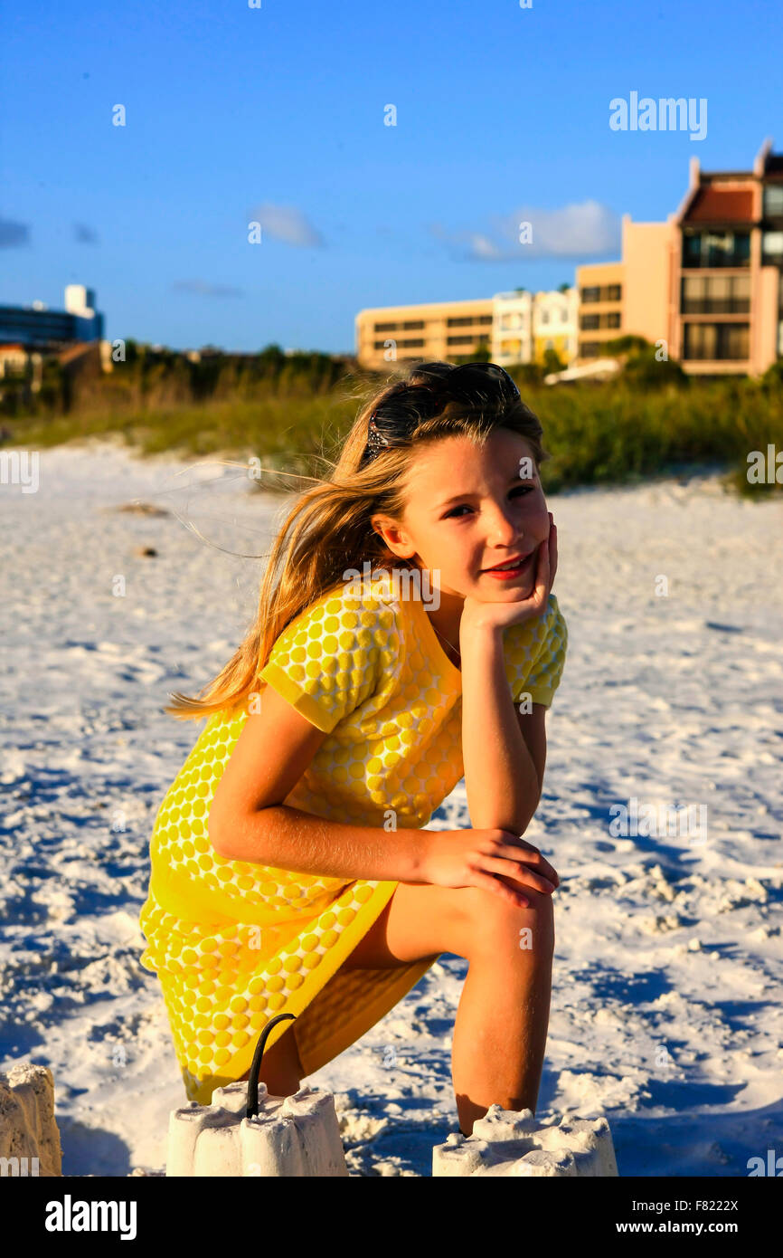 Young Girl Posing At Sunset By The Sand Castle She Built On Siesta Key