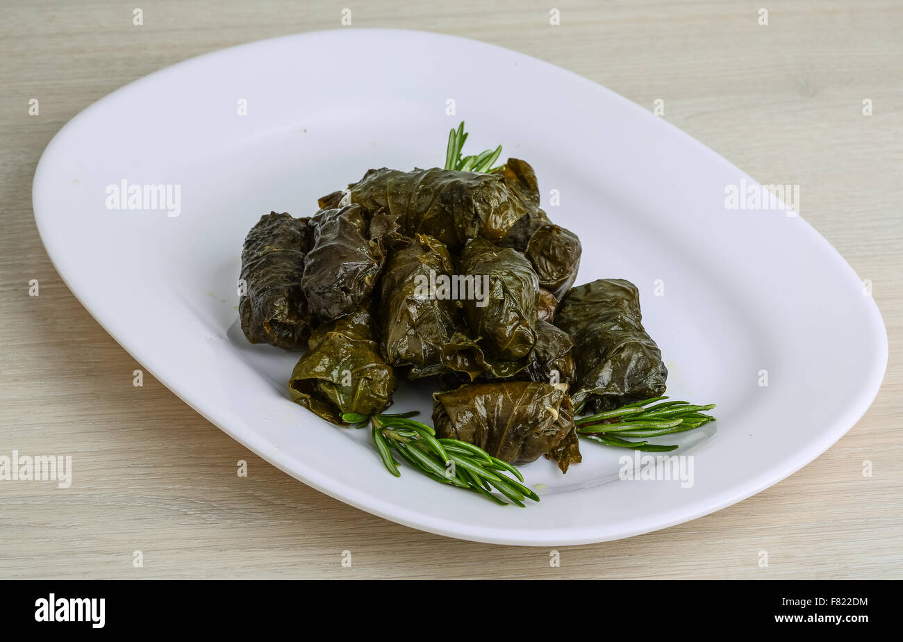 Greek dolma in grape leaves with meat served rosemary Stock Photo - Alamy