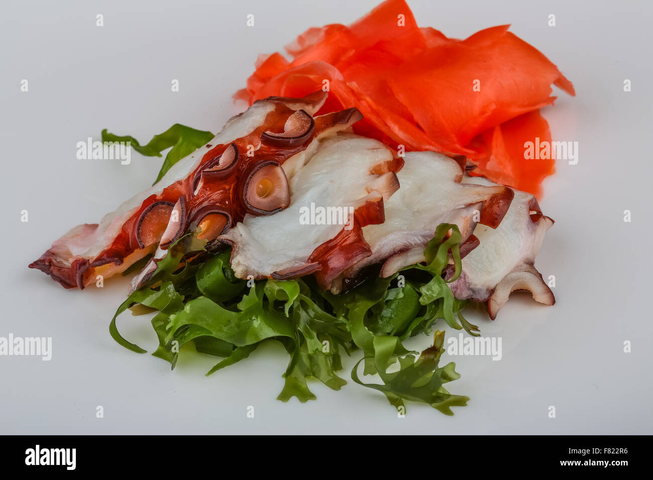 Fresh cold Octopus sashimi with ginger and nori Stock Photo - Alamy