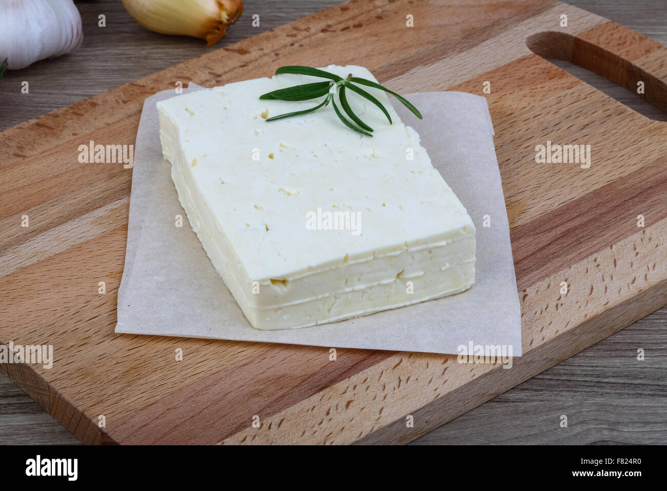 Traditional Caucasian homemade Cheese Brinza with rosemary on wood ...
