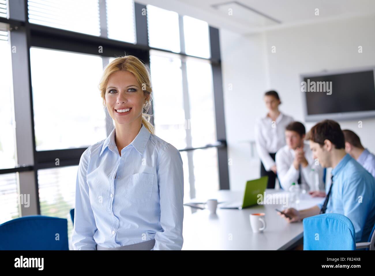 business woman with her staff, people group in background at modern ...