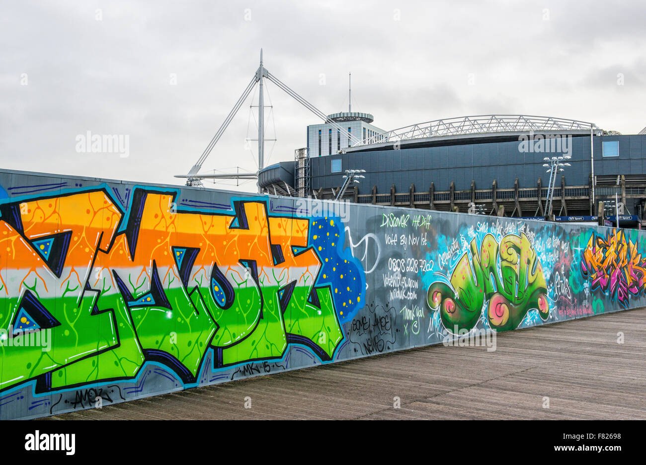 Graffiti along the Millennium Riverwalk in Cardiff, showing part of the ...