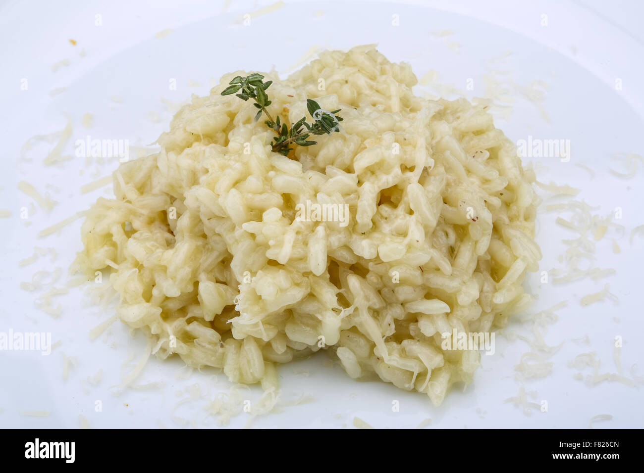Italian trditional Risotto with parmesan and thyme leaves Stock Photo ...