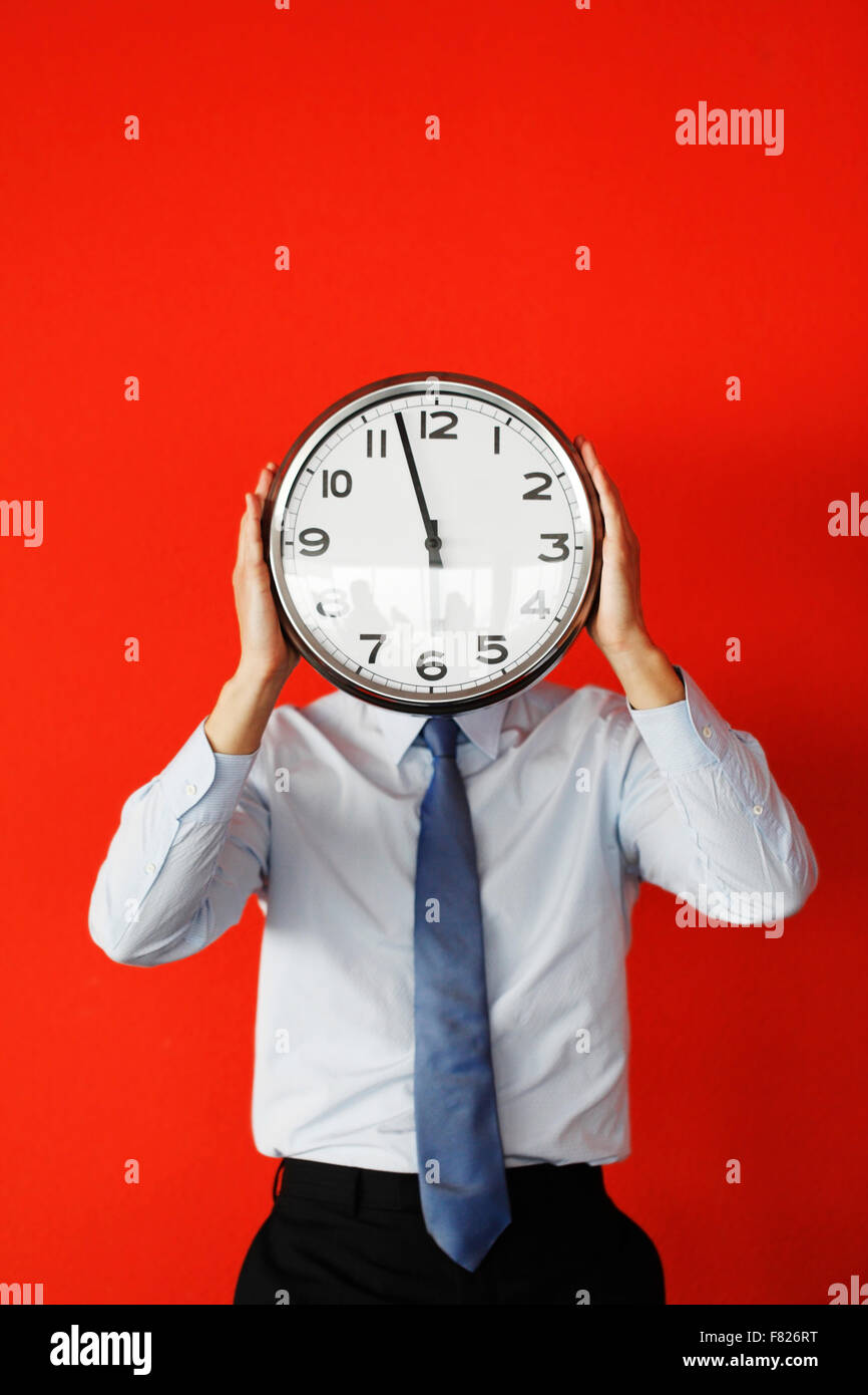 Man with clock hi-res stock photography and images - Alamy