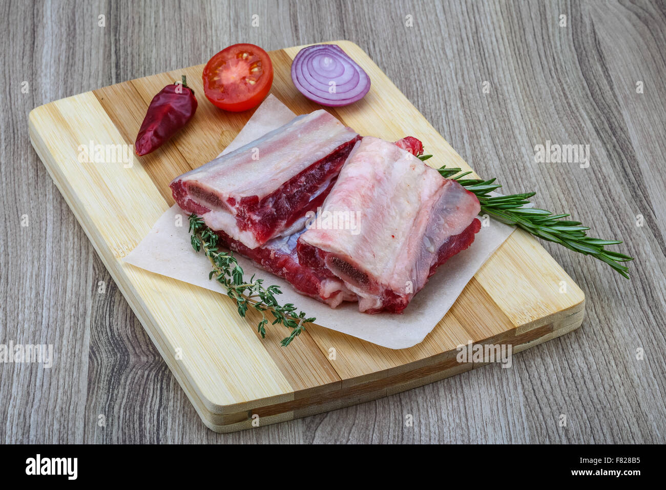 Raw beef ribs with rosemary and thyme - ready for cooking Stock Photo ...