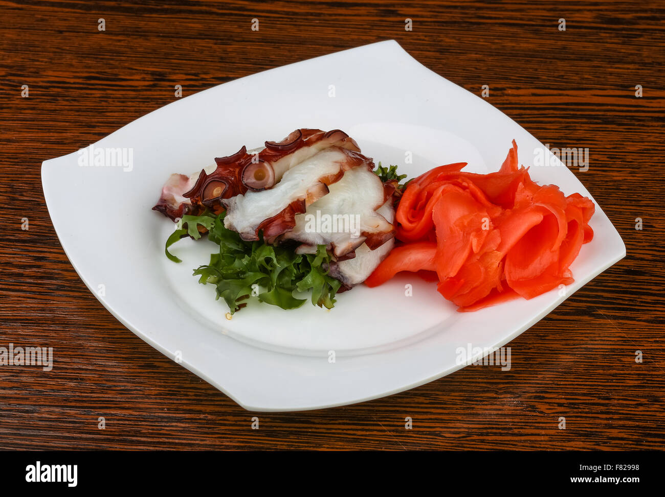 Fresh cold Octopus sashimi with nori and ginger Stock Photo - Alamy
