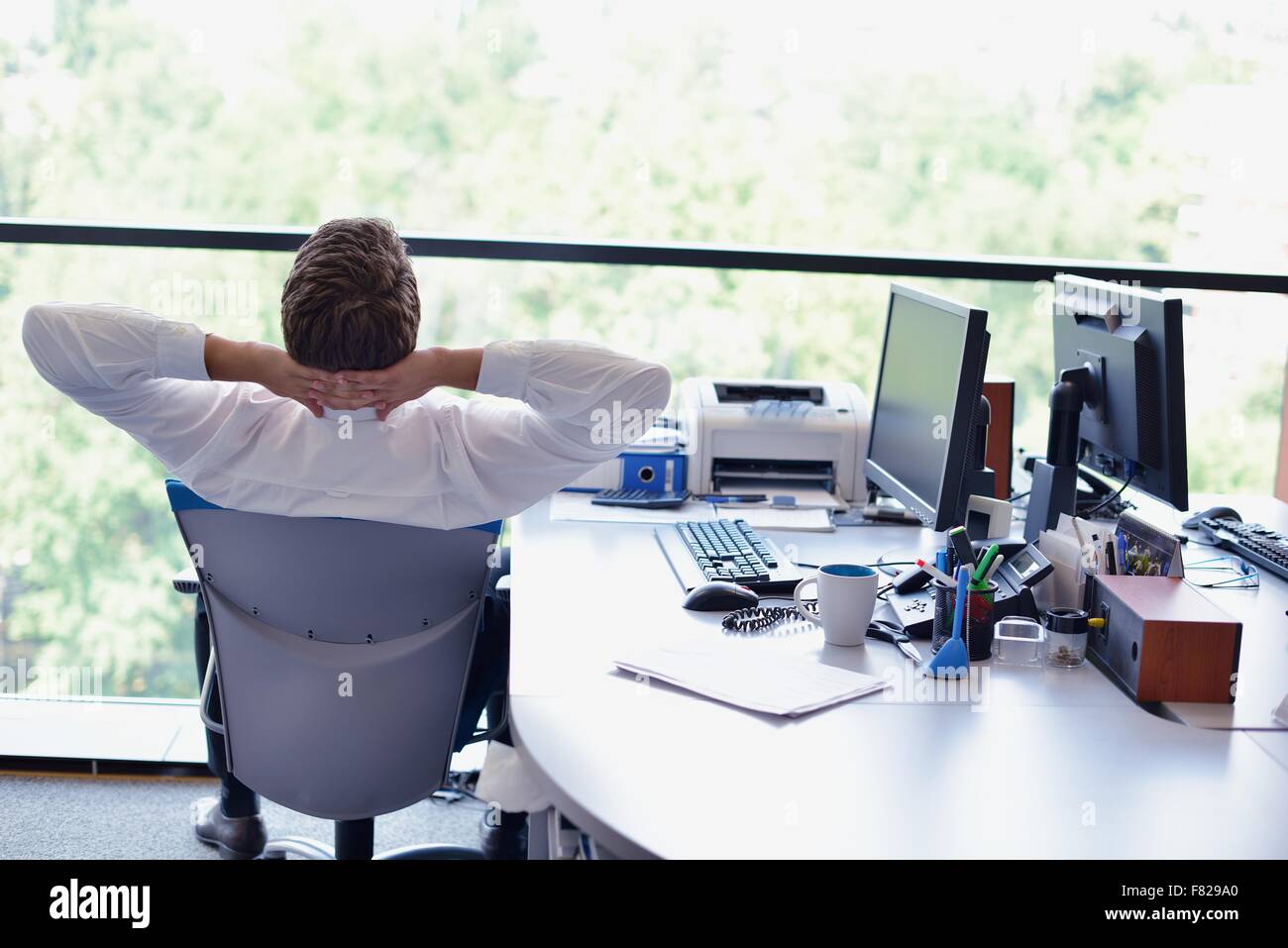 happy young business man work in modern office on computer Stock Photo ...