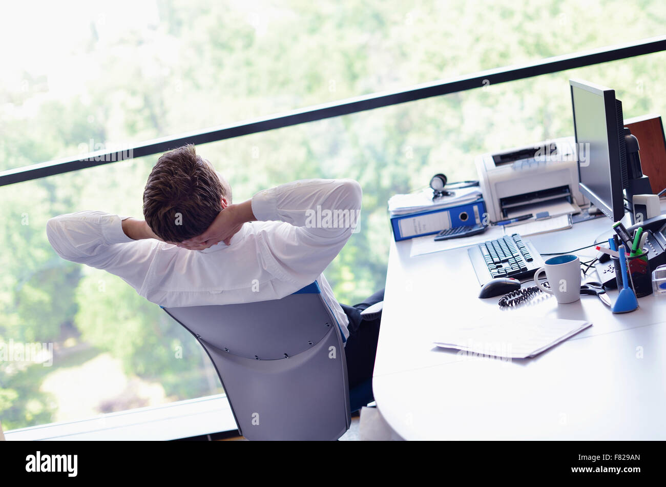 happy young business man work in modern office on computer Stock Photo ...