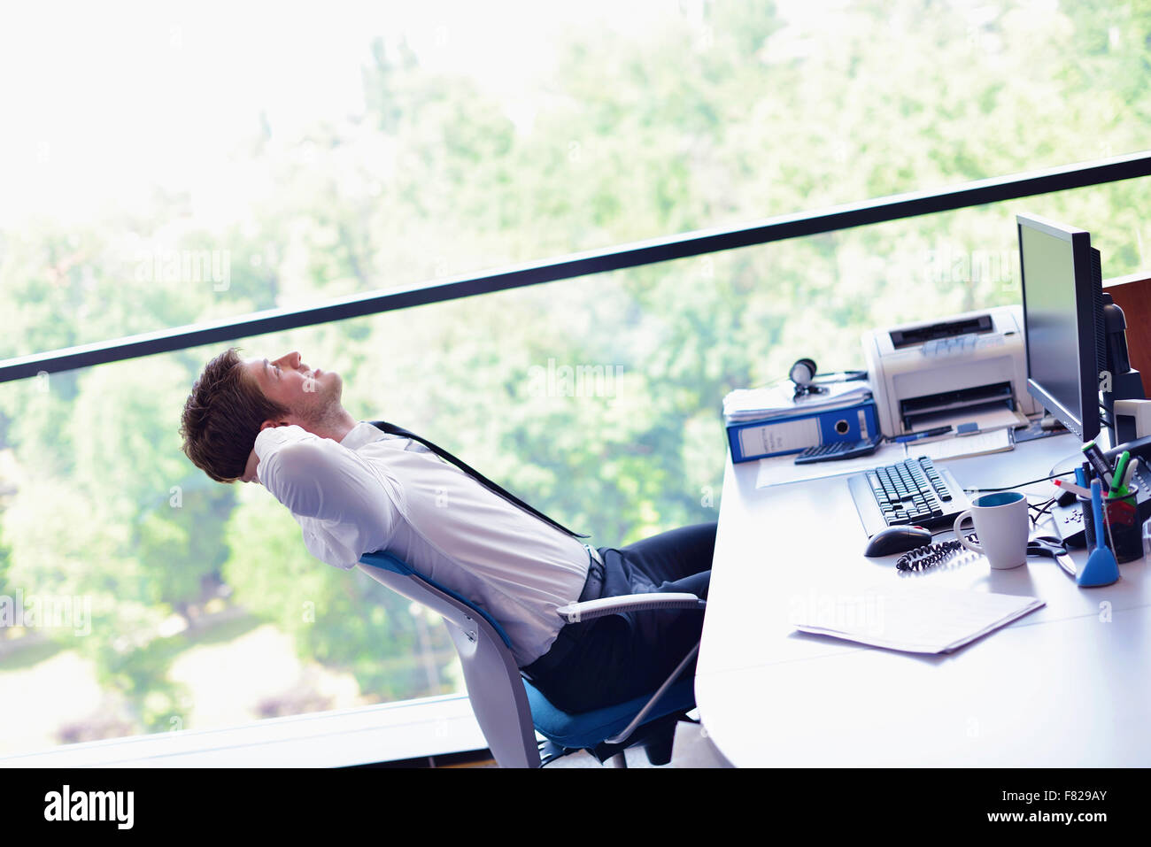 happy young business man work in modern office on computer Stock Photo ...