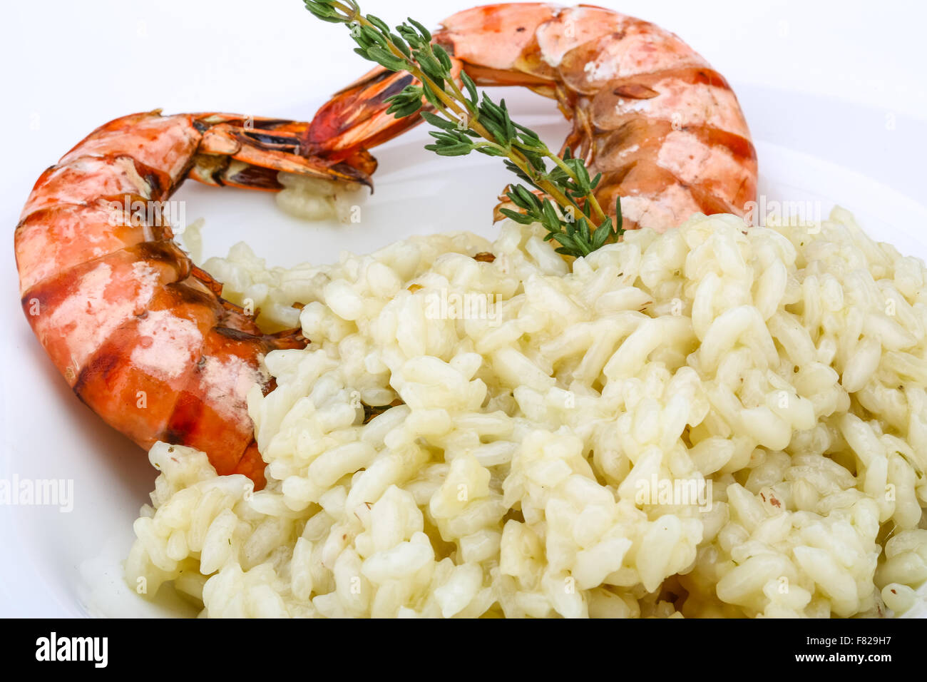 Italian trditional Risotto with tiger prawn and thyme Stock Photo - Alamy
