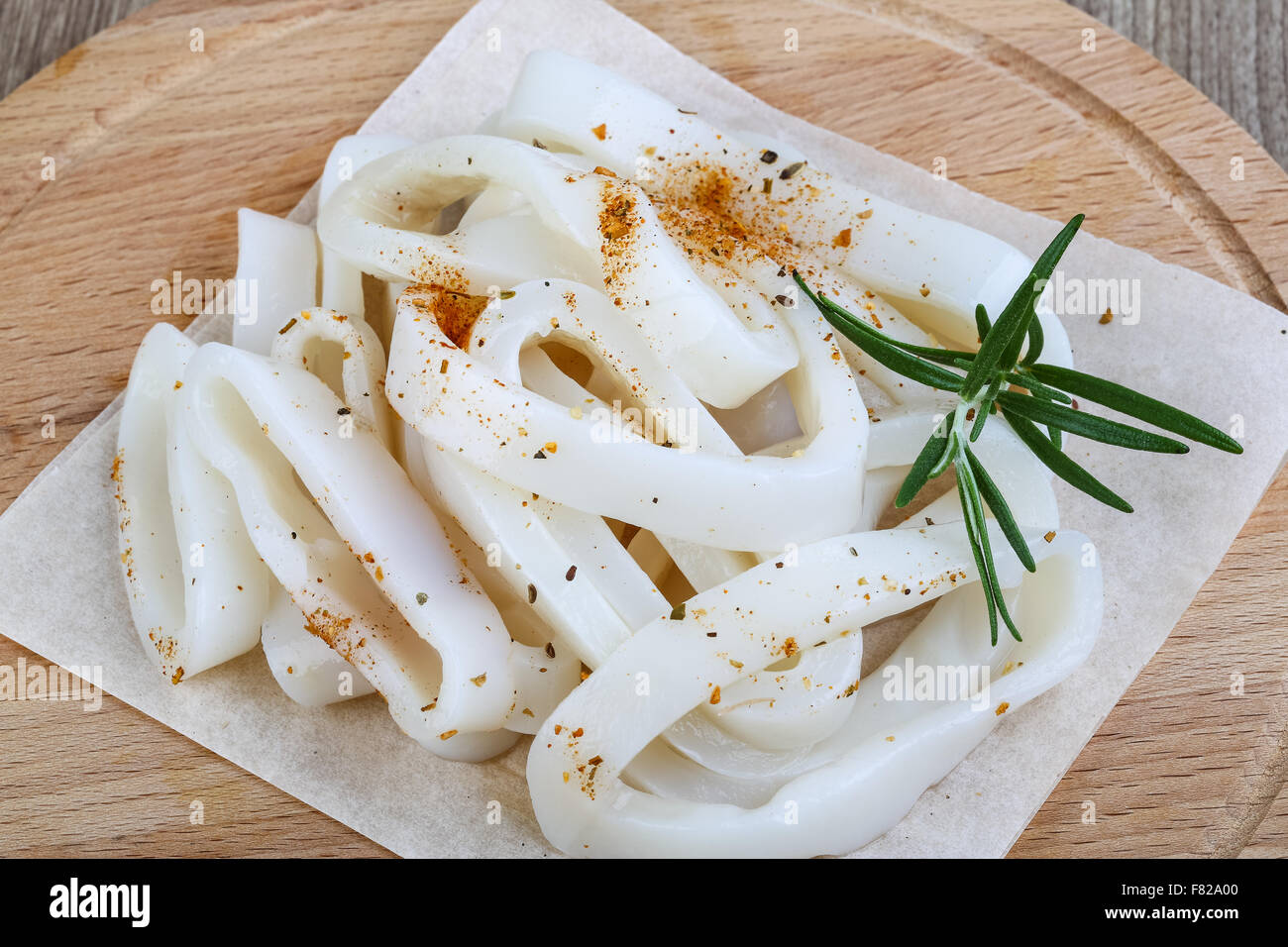 Raw squid rings herbs hi-res stock photography and images - Alamy