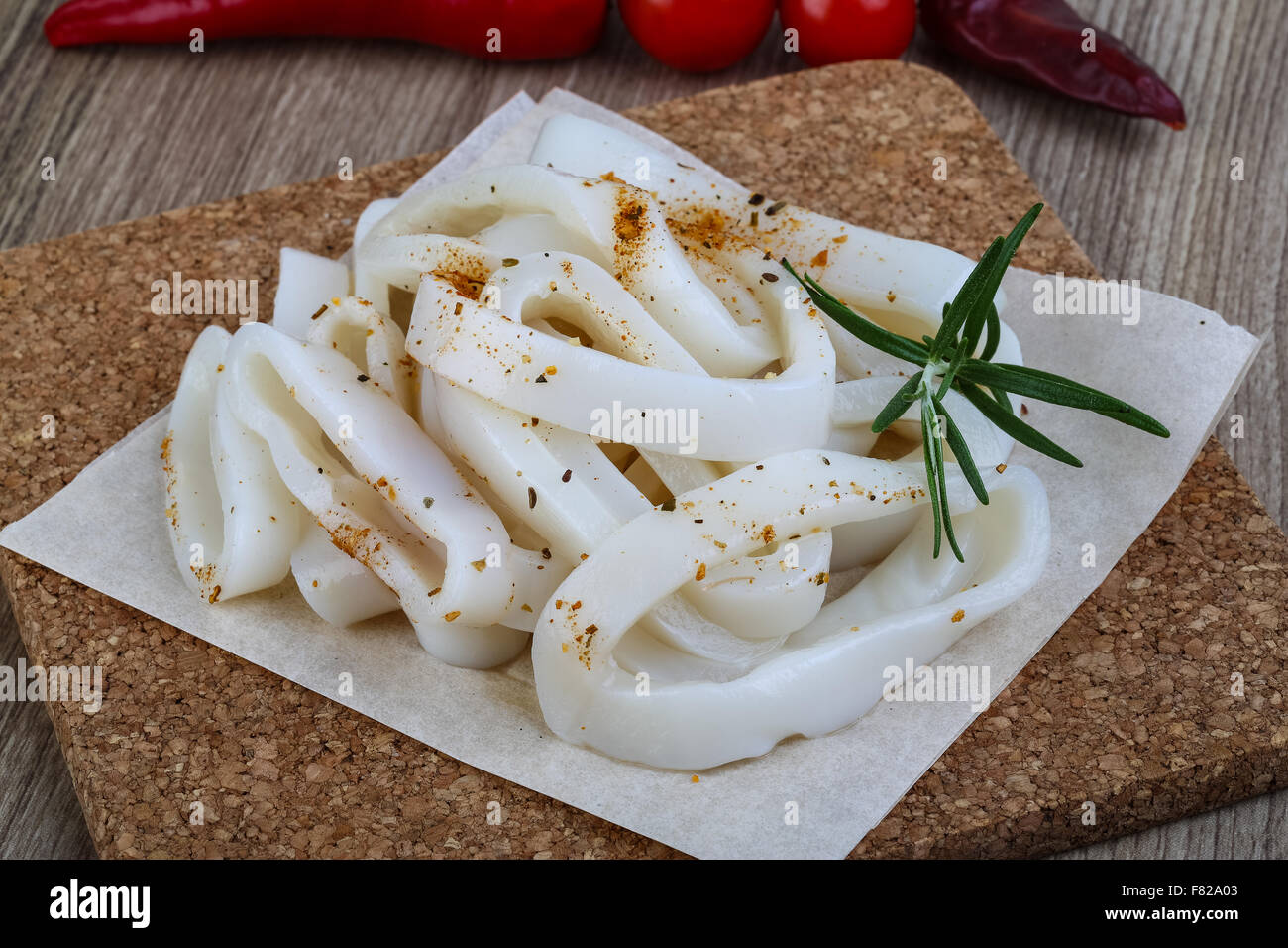 Raw squid rings with herbs - ready for cooking Stock Photo - Alamy