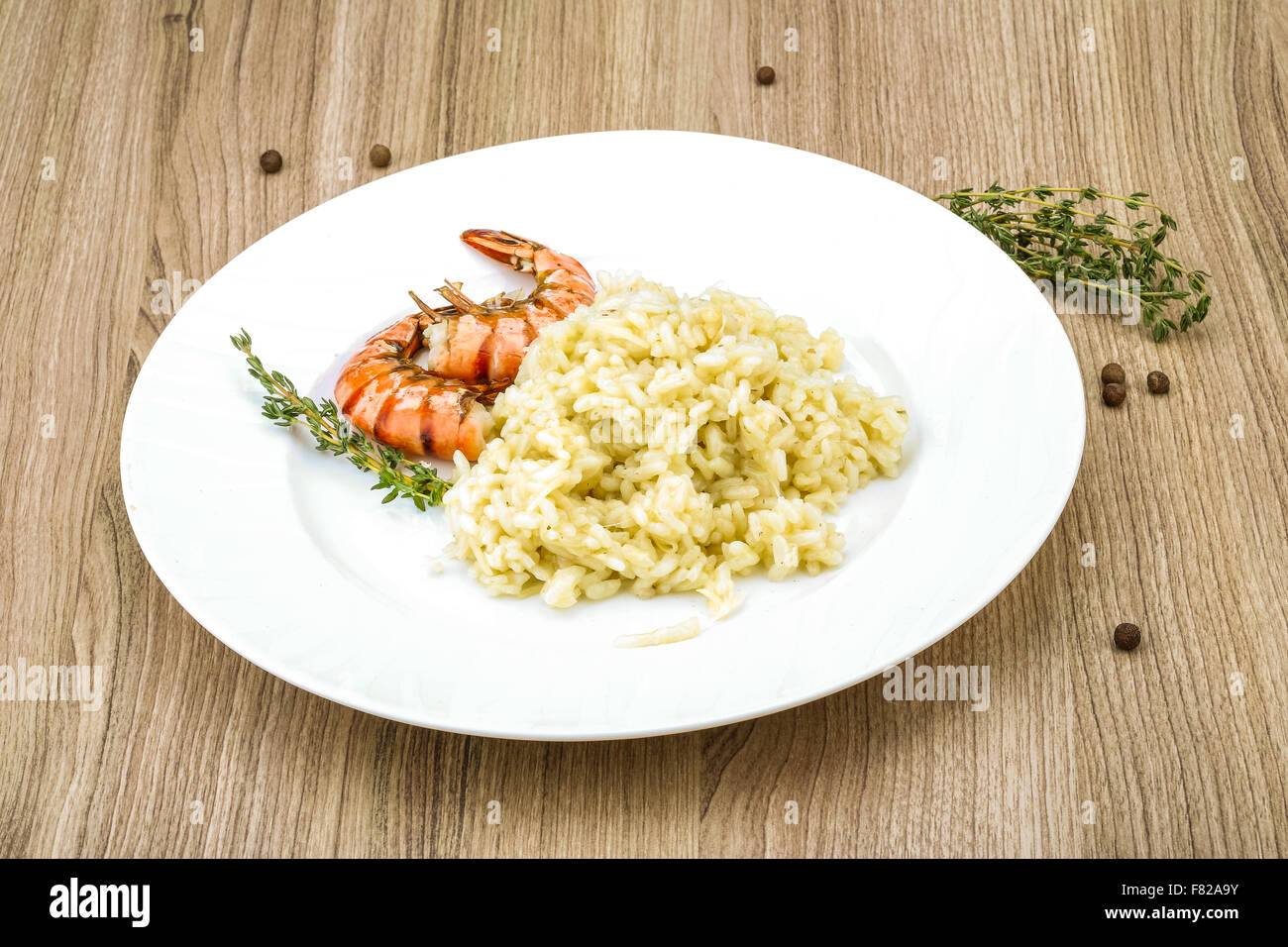 Italian trditional Risotto with tiger prawn and thyme Stock Photo - Alamy