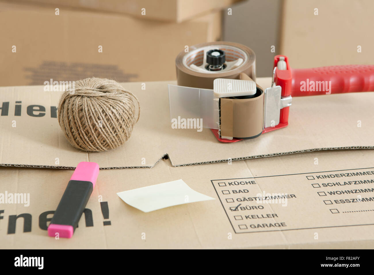 a carton for a move with tape, packet band and colored pencil Stock ...