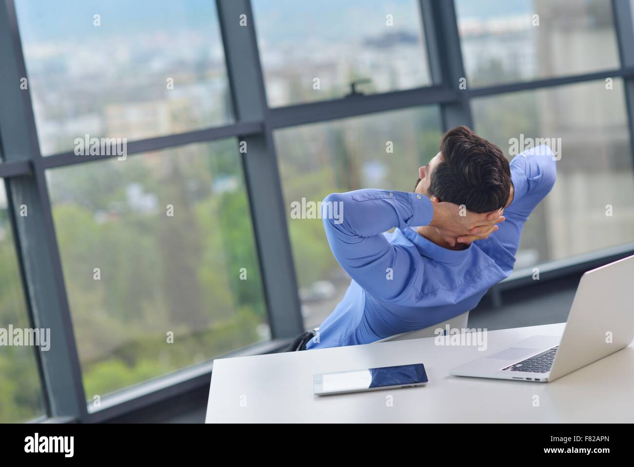 happy young business man work in modern office on computer Stock Photo ...
