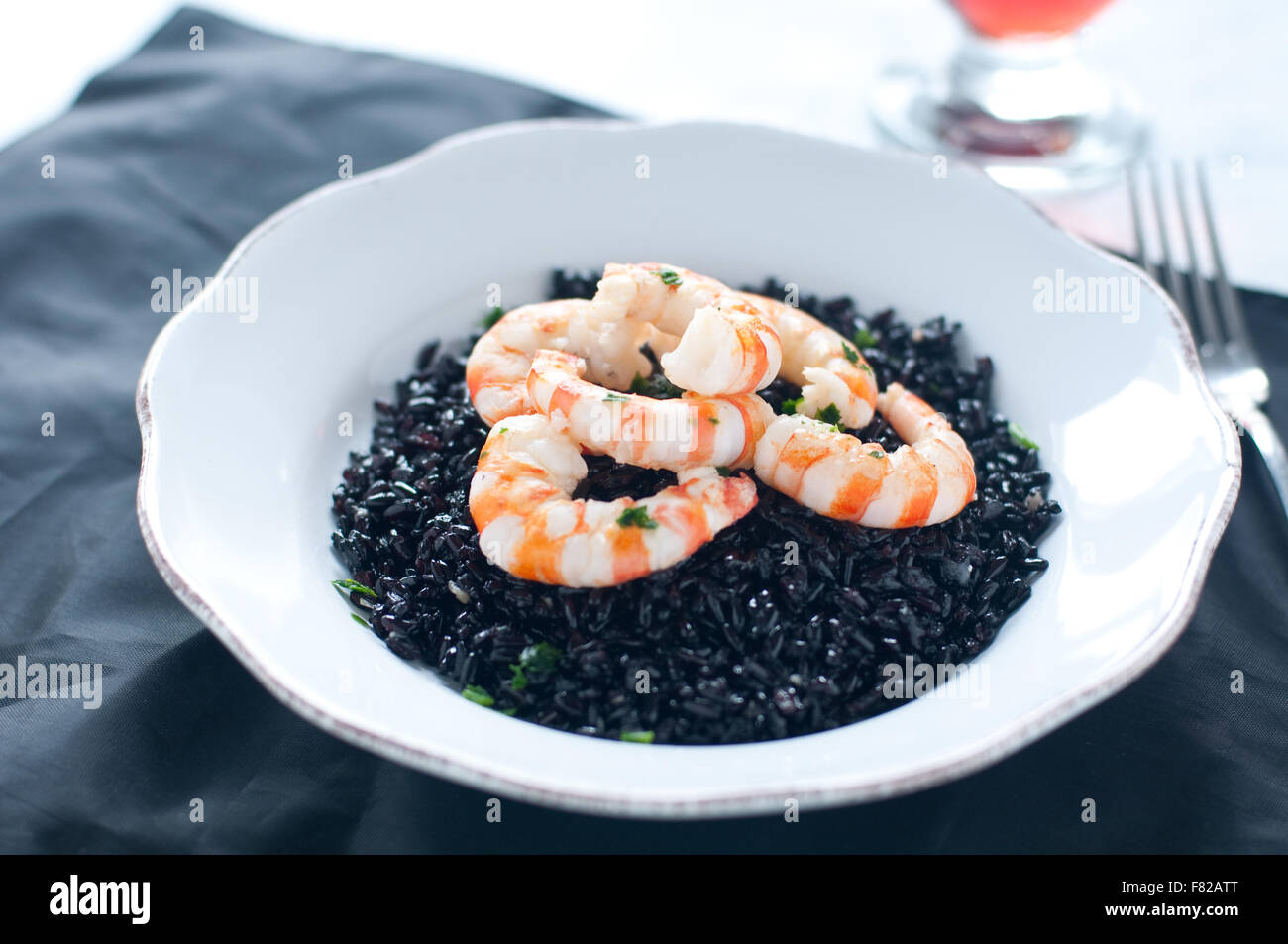 Black rice with prawns fresh, italy Stock Photo - Alamy