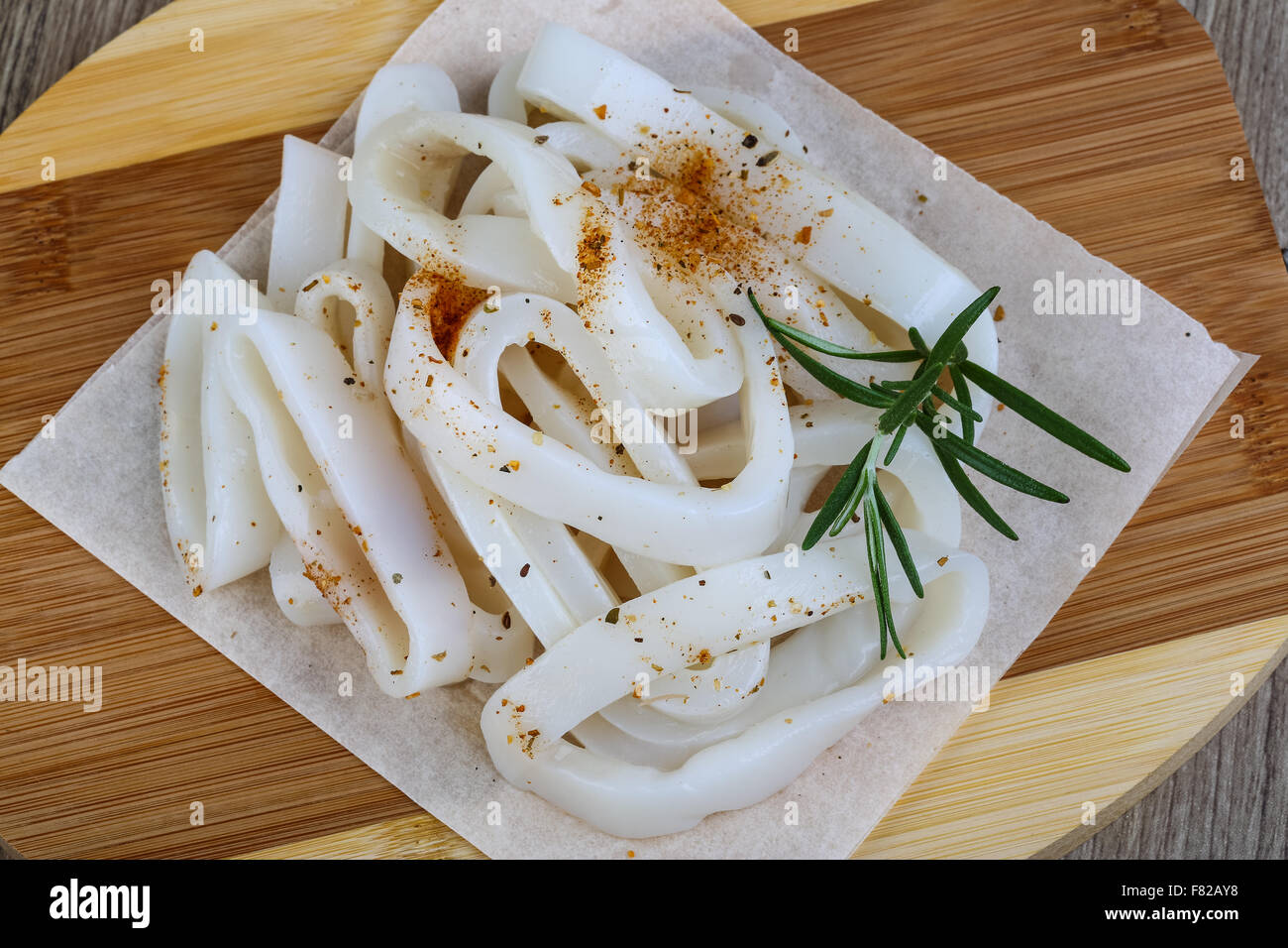 Raw squid rings herbs hi-res stock photography and images - Alamy