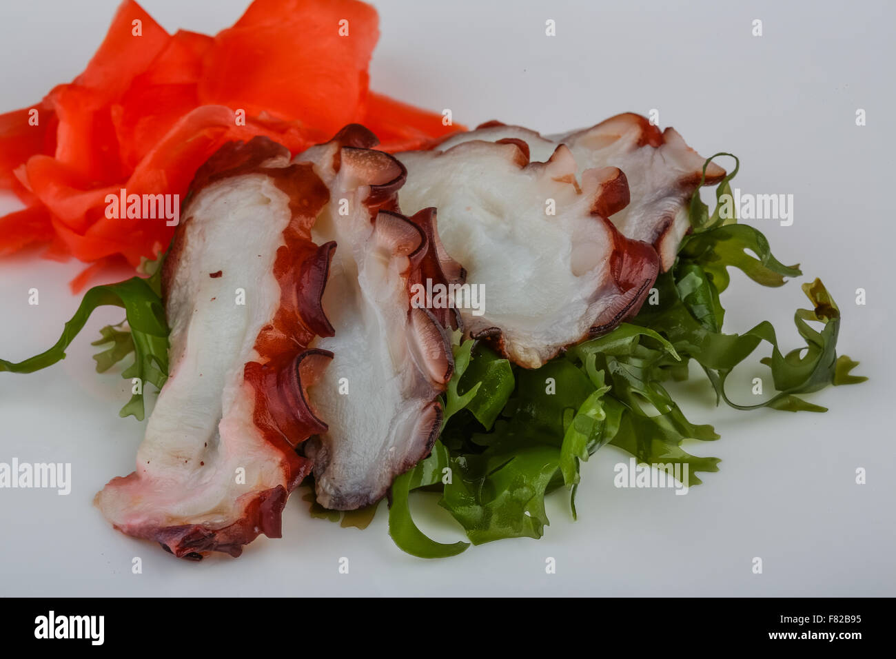 Fresh cold Octopus sashimi with ginger and nori Stock Photo - Alamy