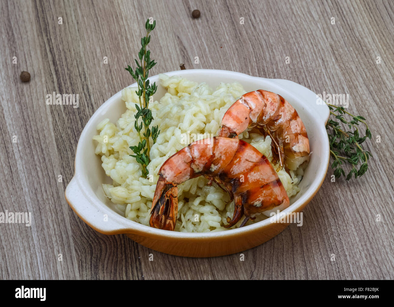 Italian trditional Risotto with tiger prawn and thyme Stock Photo - Alamy