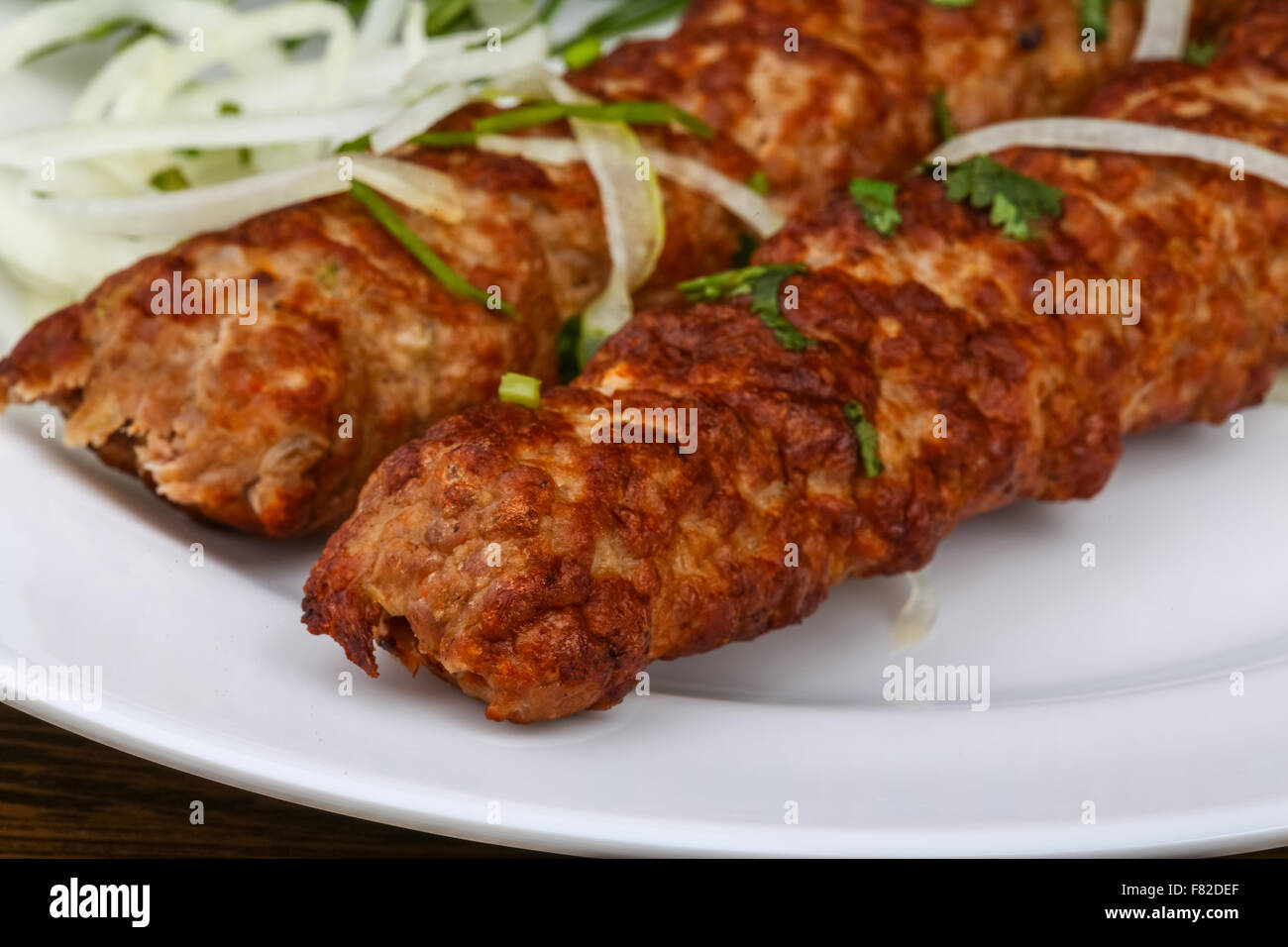 Hot Beef kebab with onion rings and rosemary Stock Photo - Alamy
