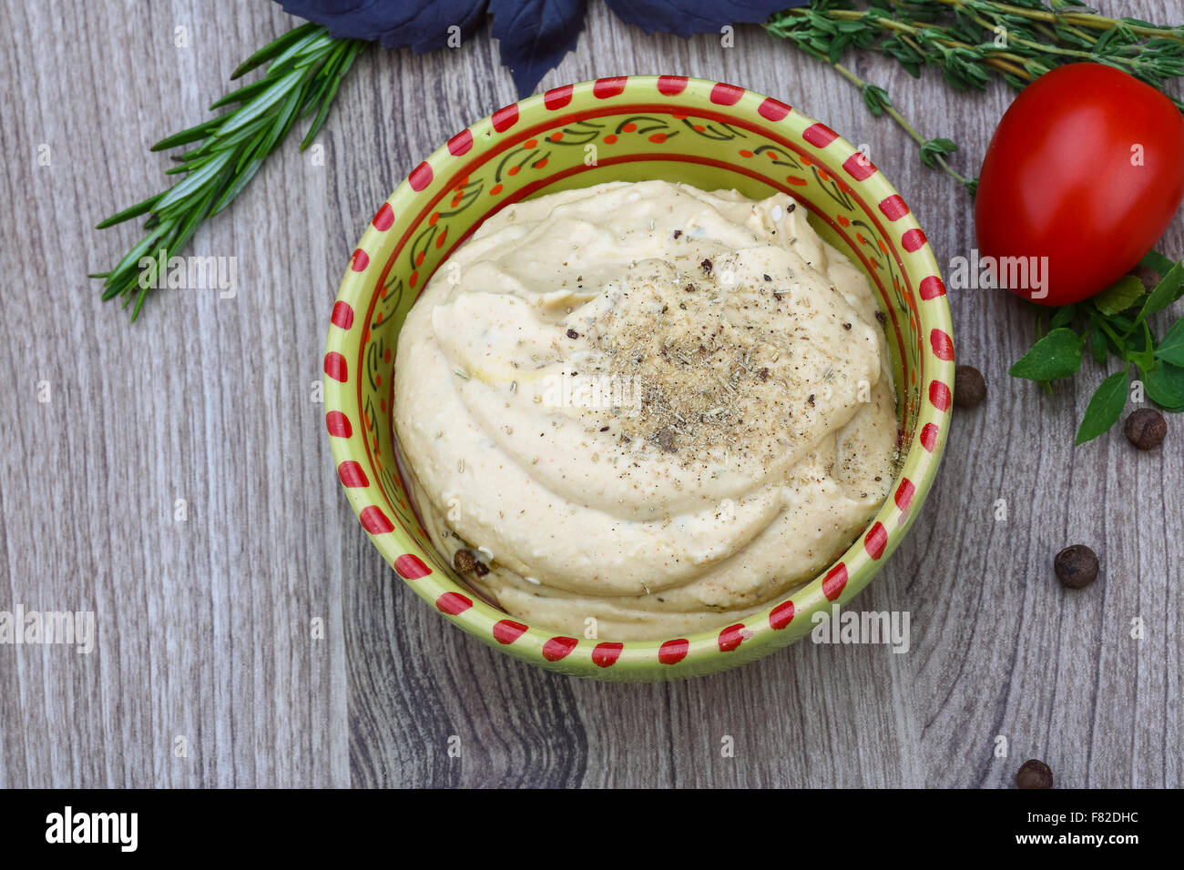Arabic traditional cusine - hummus with olive oil, herbs and spices ...