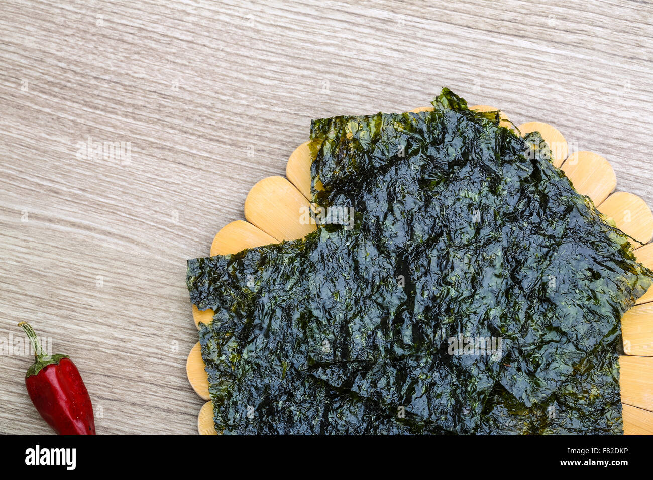 Korean traditional snack - Nori seaweed sheets on the wood background ...