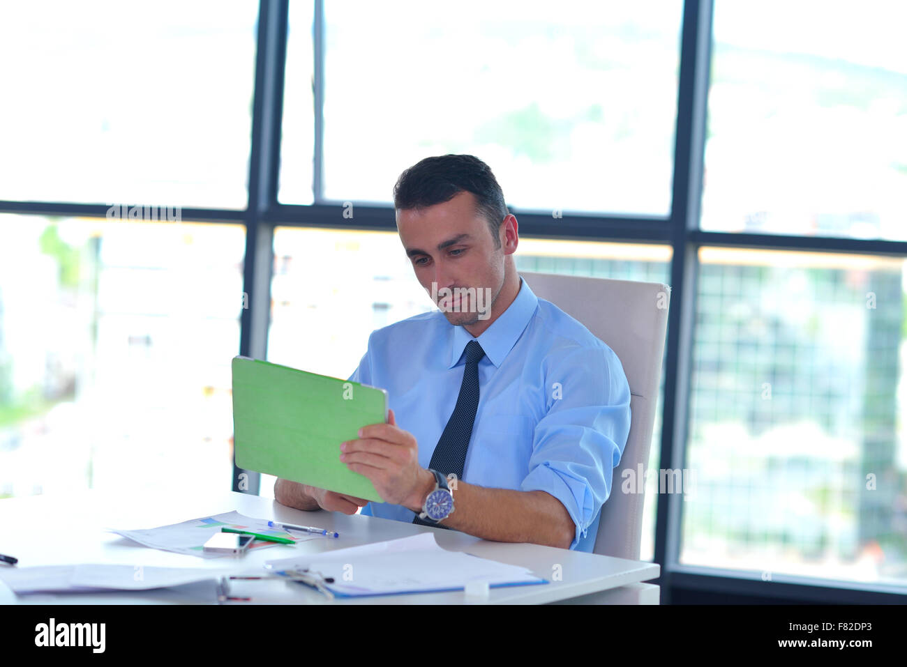close-up of human hand business man using tablet compuer at office ...
