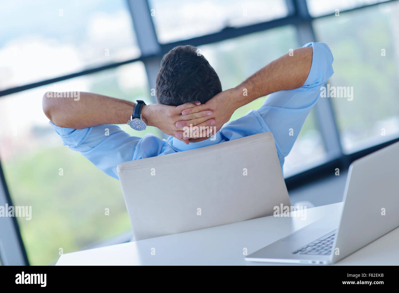 happy young business man work in modern office on computer Stock Photo ...