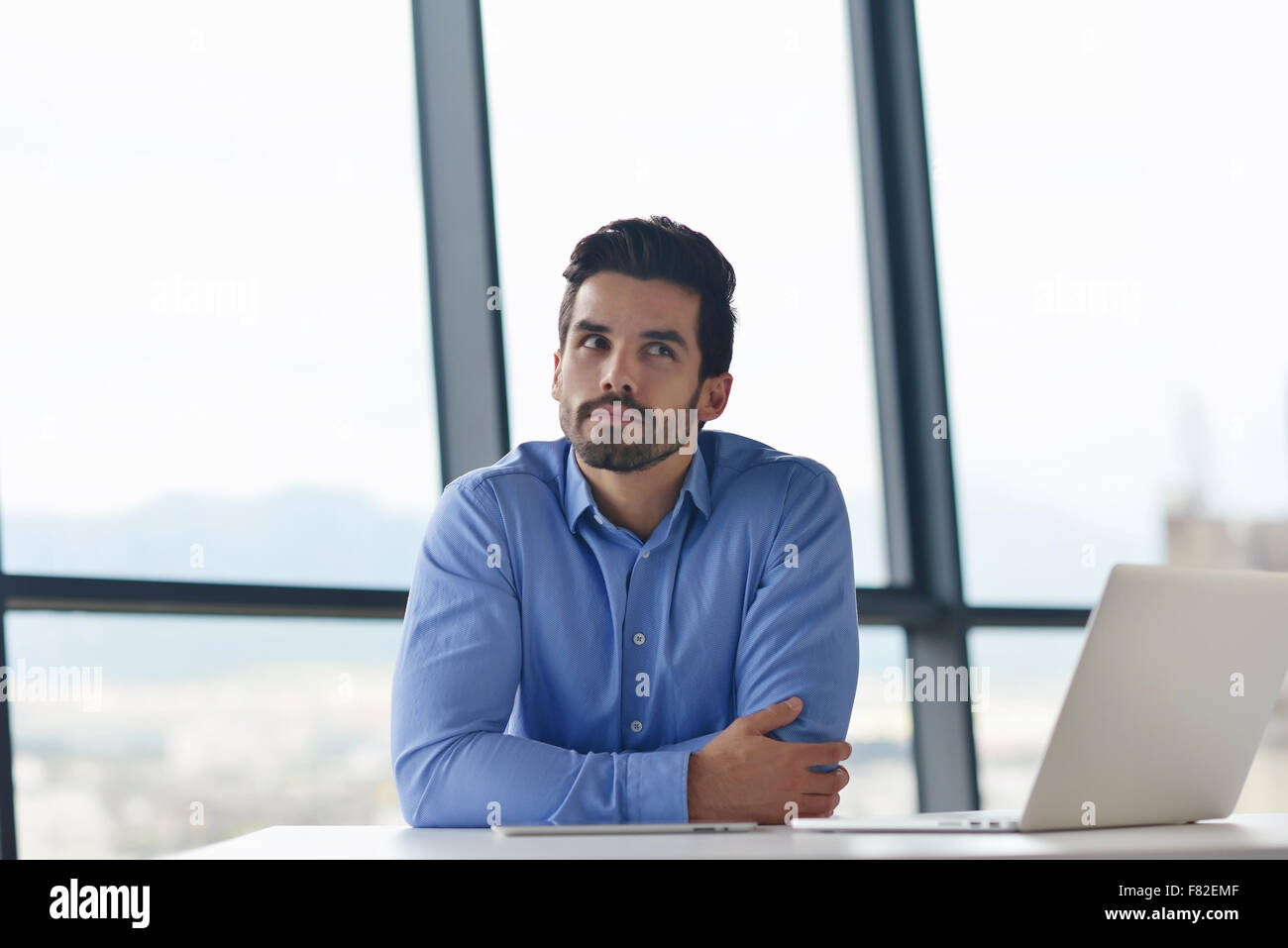 happy young business man work in modern office on computer Stock Photo ...