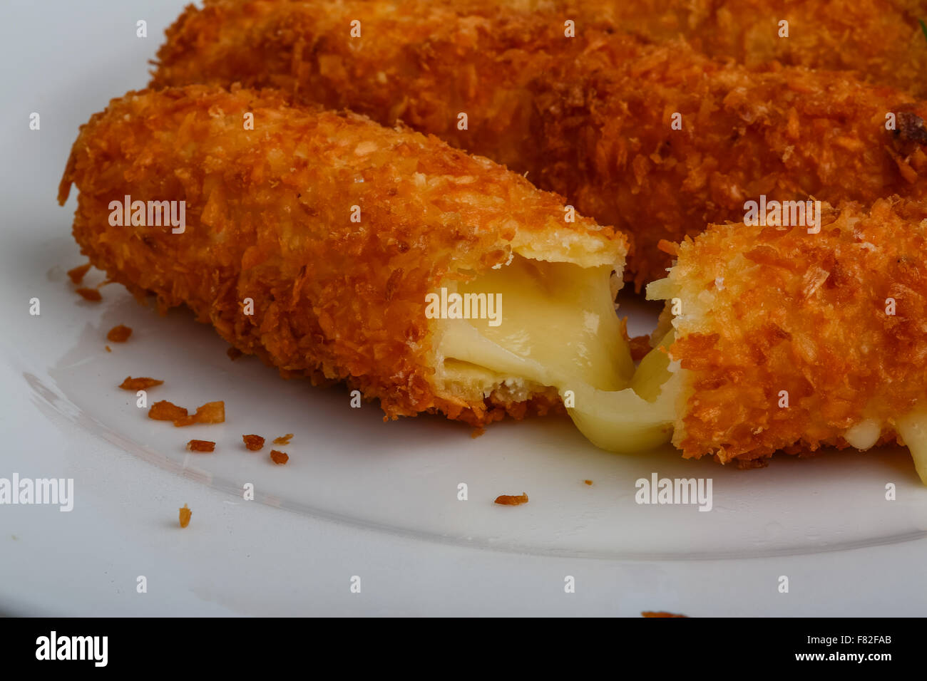 Fried cheese sticks in pan with dill Stock Photo - Alamy