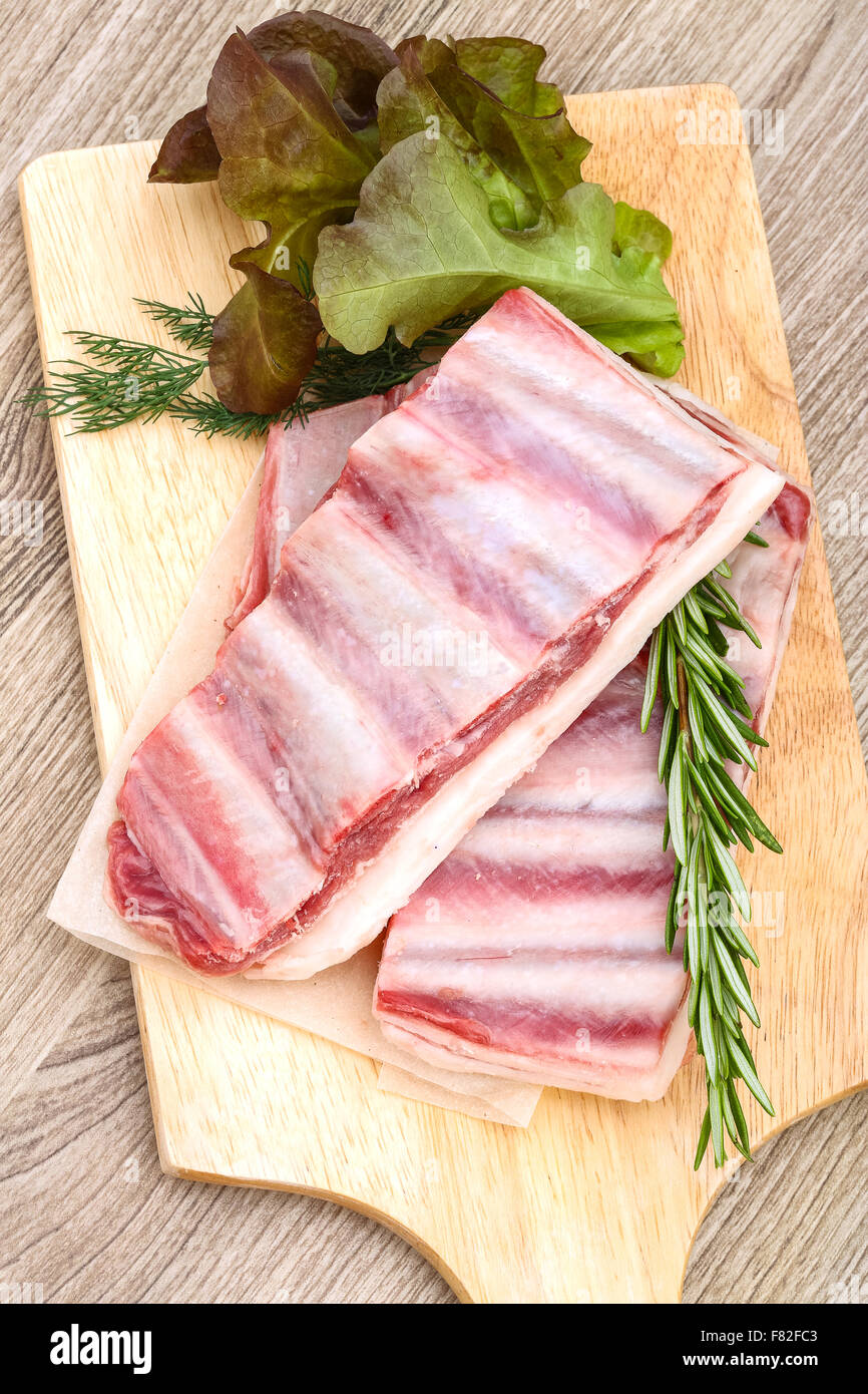 Fresh cold Raw lamb ribs with garlik and pepper - ready for cooking ...