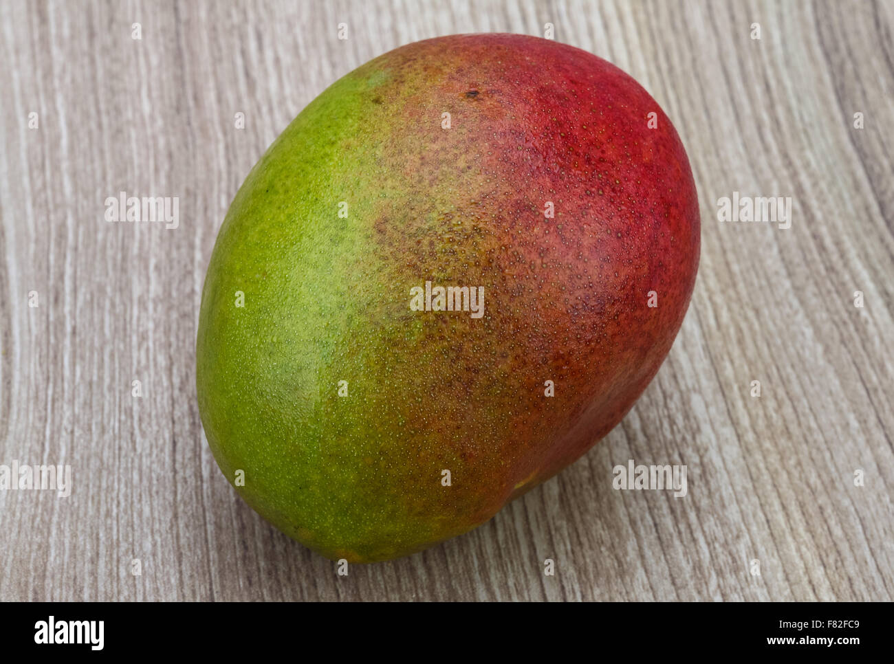 Fresh ripe mango fruit on the wood background Stock Photo - Alamy