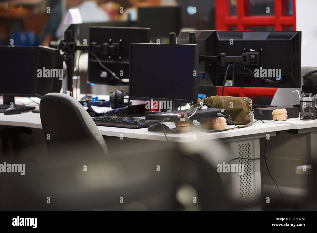 dual monitor screen and laptop computer at modern office indoors ...