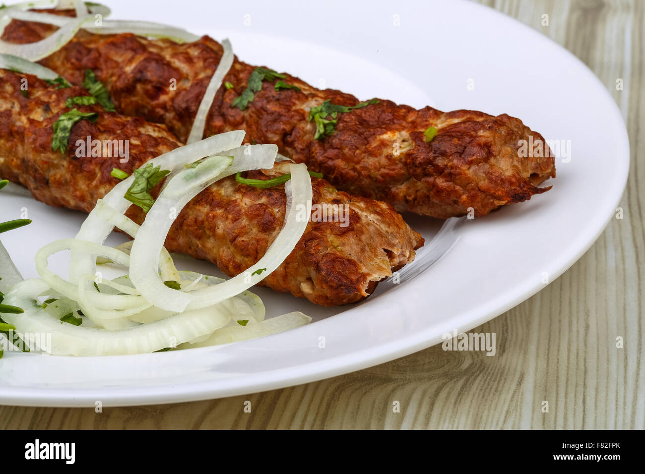 Hot Beef kebab with onion rings and rosemary Stock Photo - Alamy