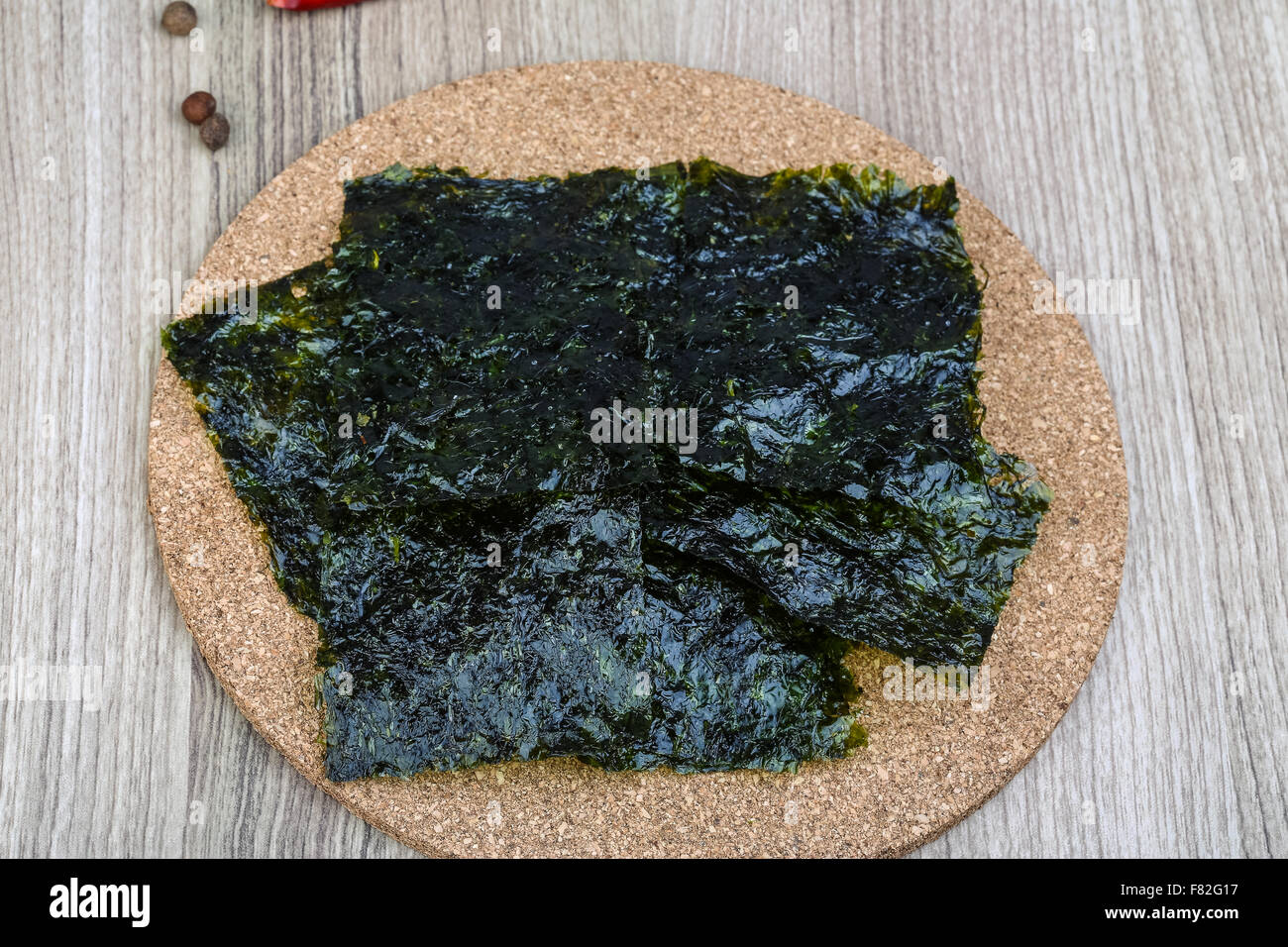 Korean traditional snack - Nori seaweed sheets on the wood background ...
