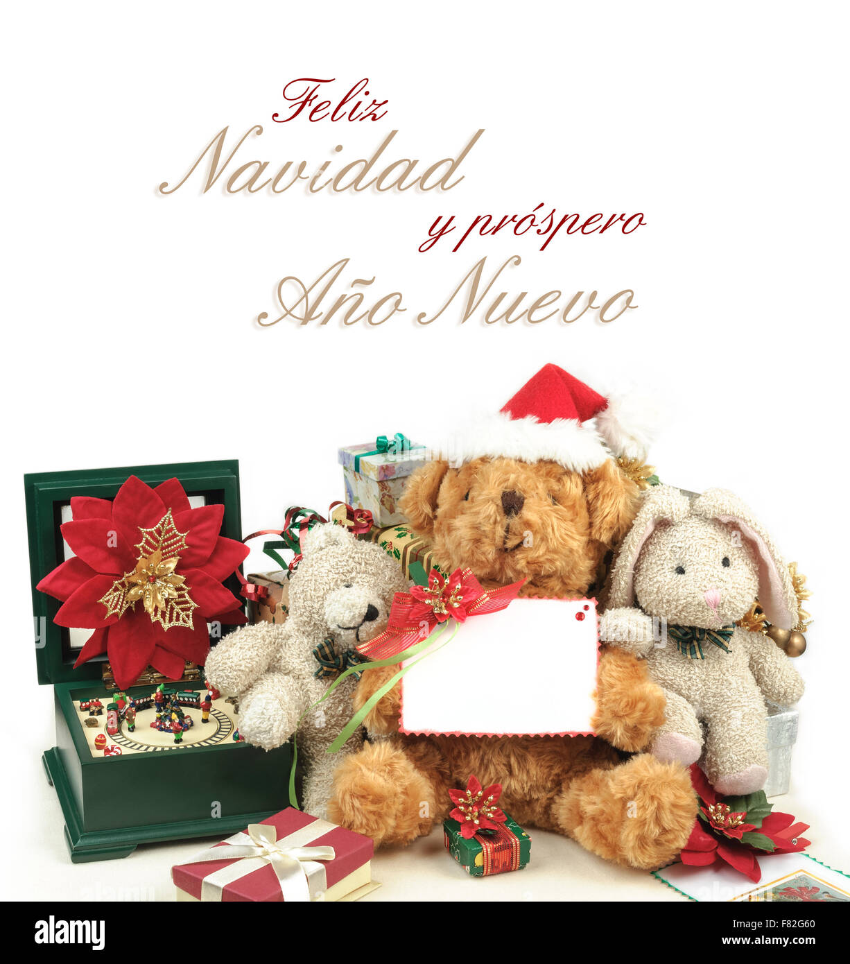 Christmas greeting card with teddy bear, toys & gifts, the text Feliz ...
